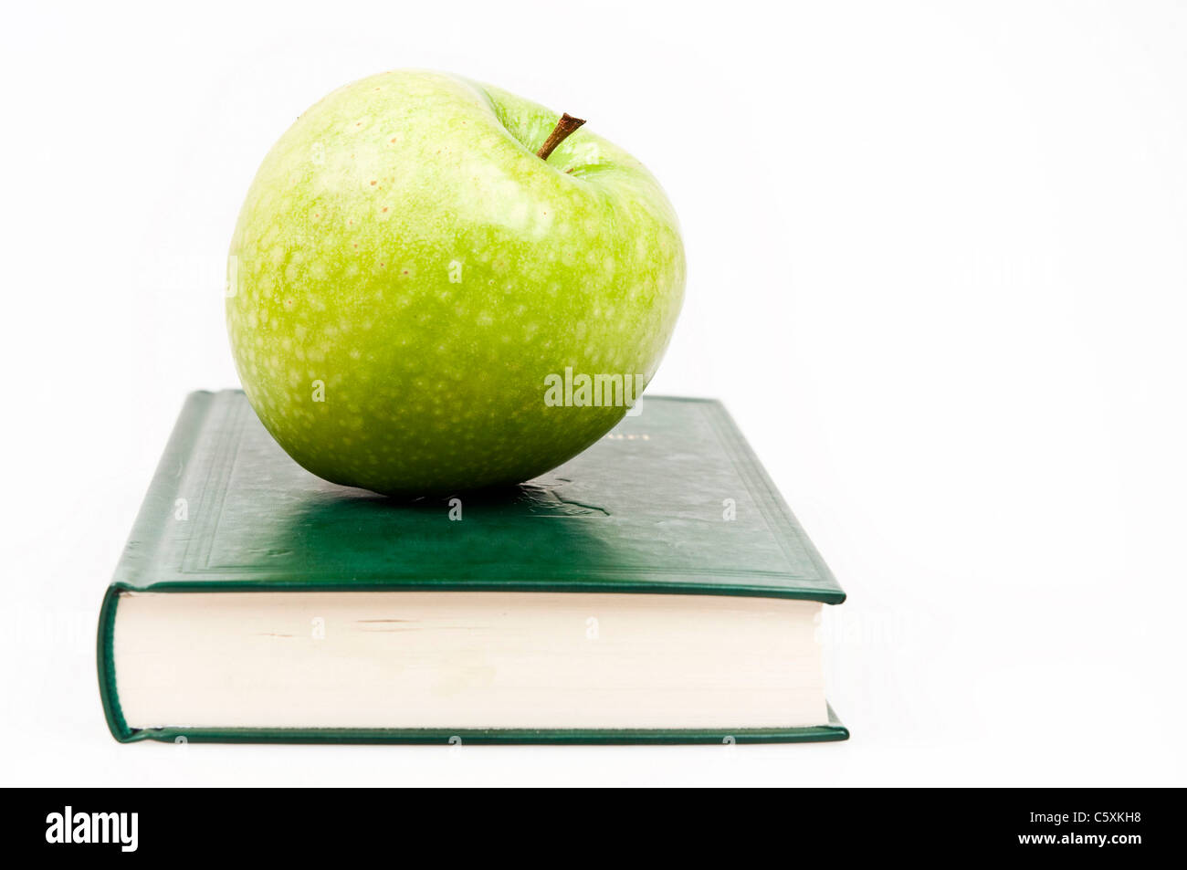 Isolated book and apple on white Stock Photo - Alamy