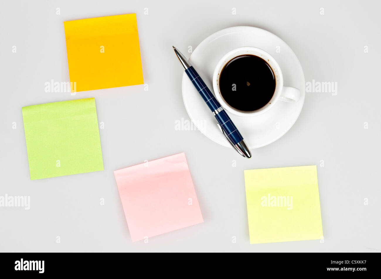 Coffee and post it on white Stock Photo - Alamy
