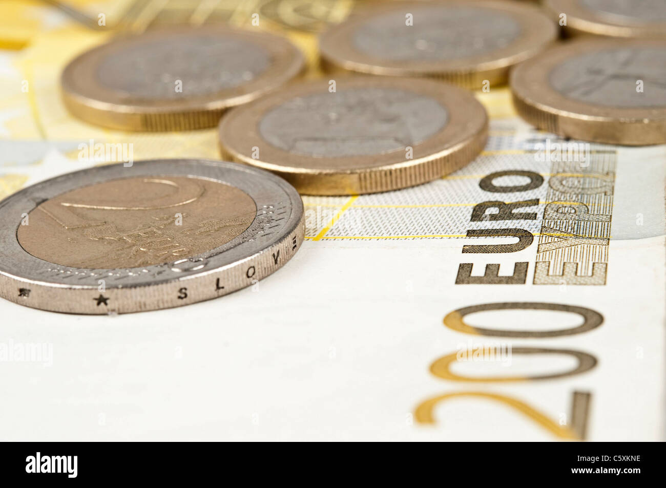 Euro banknotes and coins closeup Stock Photo - Alamy