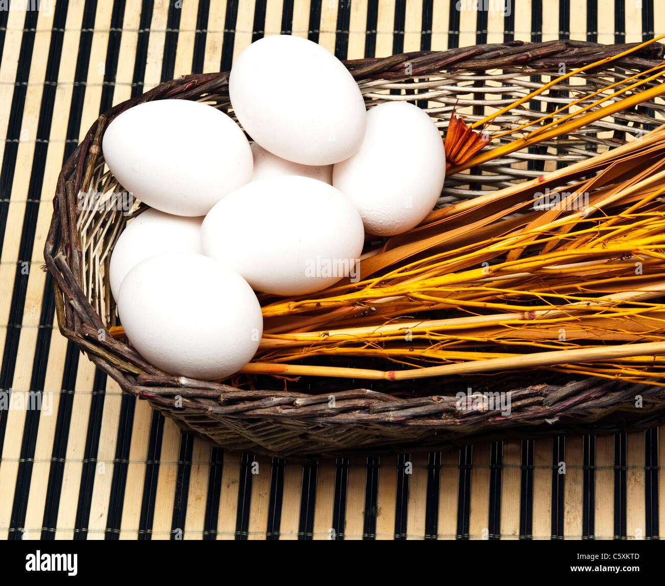 Group of eggs in basket Stock Photo - Alamy