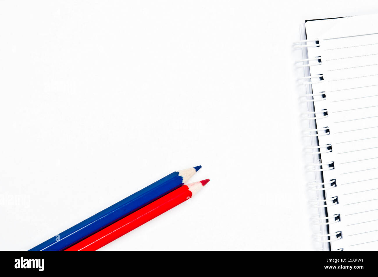 Two pencils and a notebook Stock Photo - Alamy