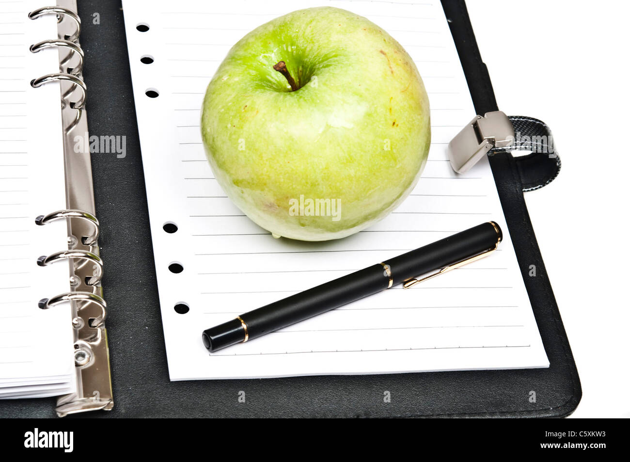 isolated apple on an notebook Stock Photo - Alamy