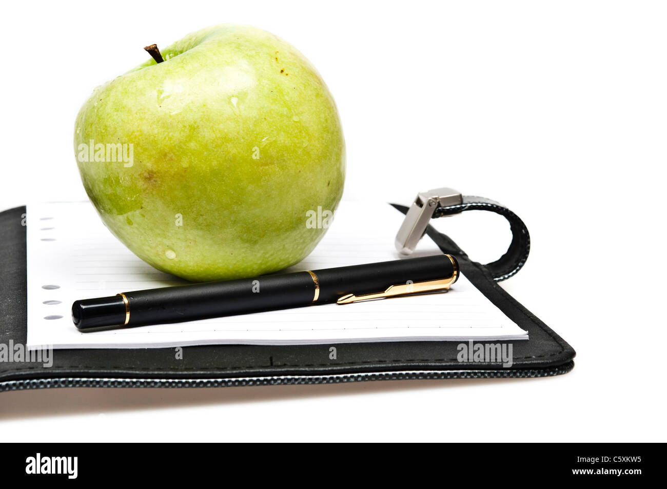 isolated apple on an notebook Stock Photo - Alamy