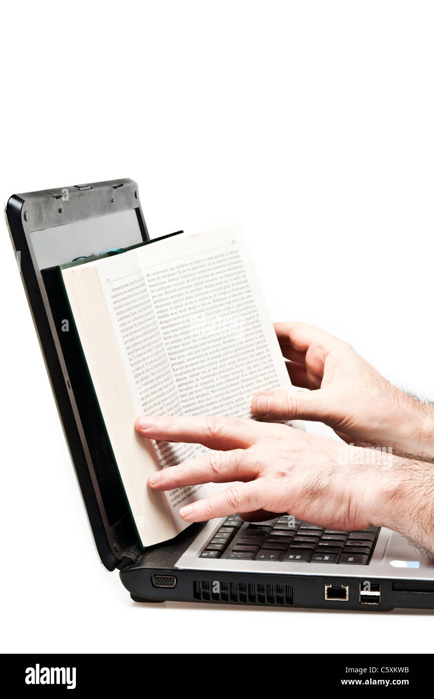 Reading laptop and book Cut Out Stock Images & Pictures - Alamy