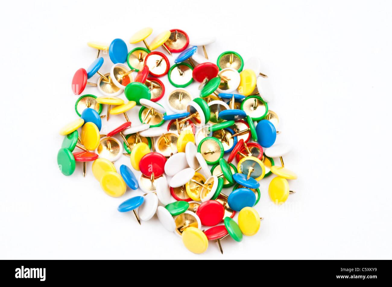 Many pushpins on white background Stock Photo - Alamy