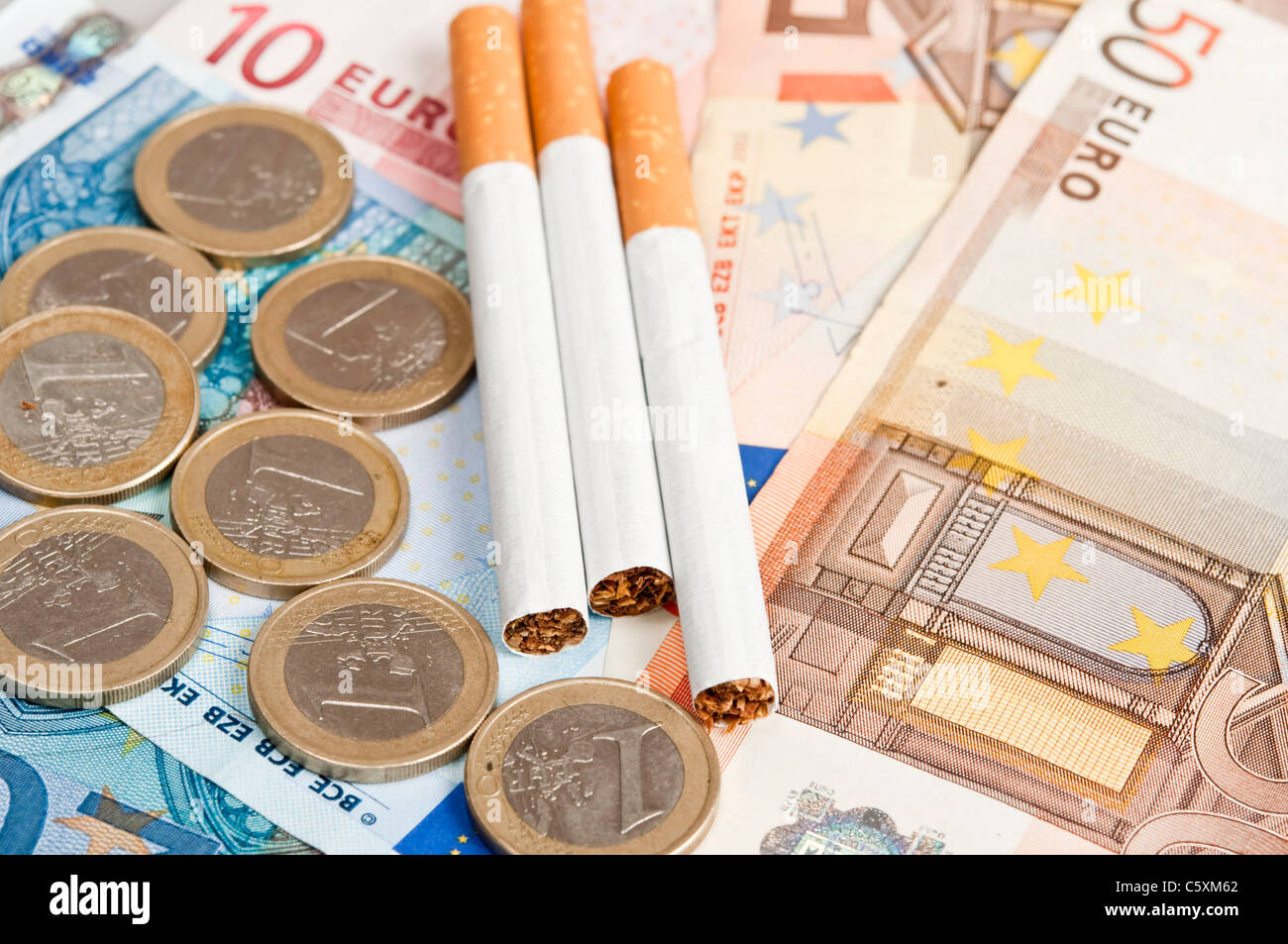 Money and group of cigarettes Stock Photo - Alamy
