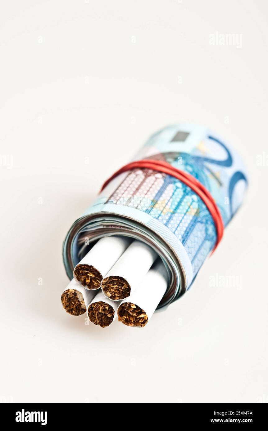 Money and group of cigarettes Stock Photo - Alamy
