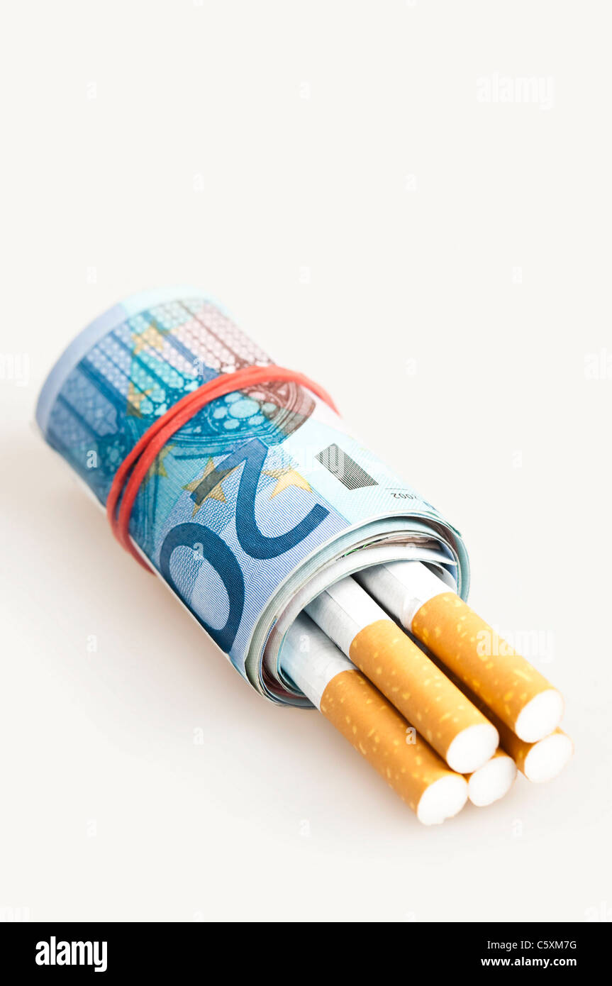 Money and group of cigarettes Stock Photo - Alamy