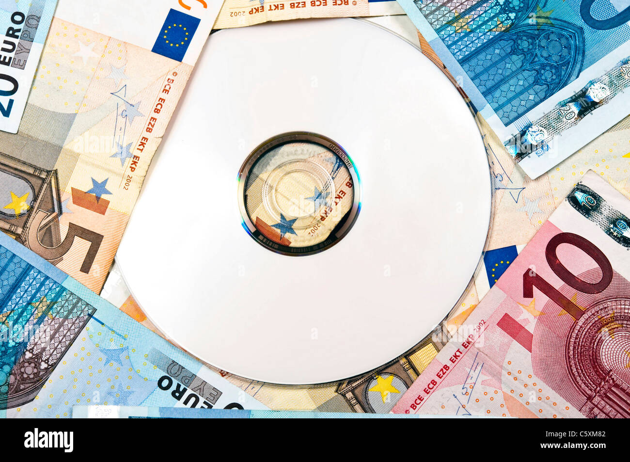 Cd on many euro banknotes Stock Photo - Alamy
