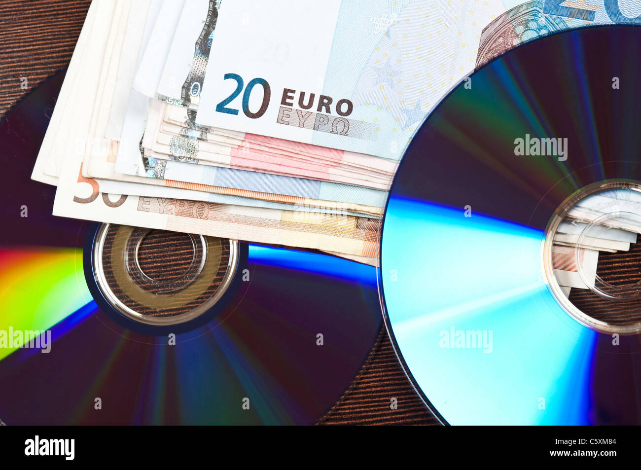 Cd on many euro banknotes Stock Photo - Alamy