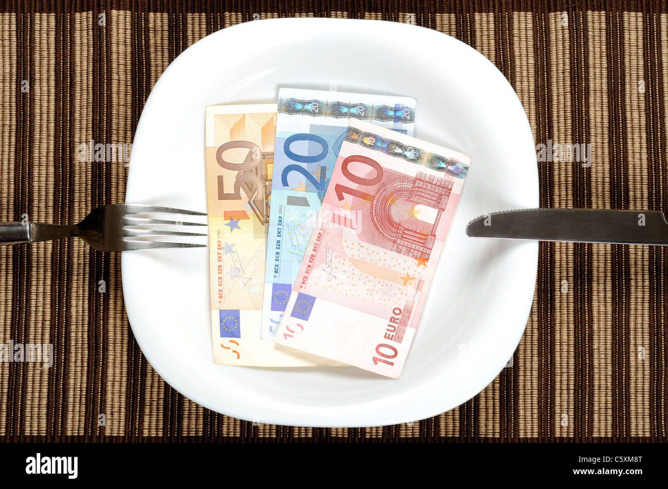 Fork knife plate money hi-res stock photography and images - Alamy