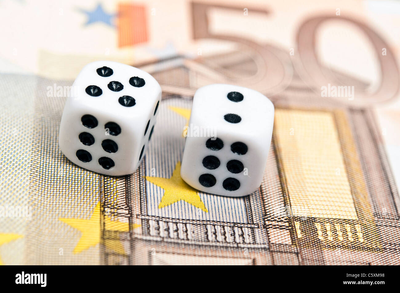 Dice on fifty euro banknote Stock Photo - Alamy