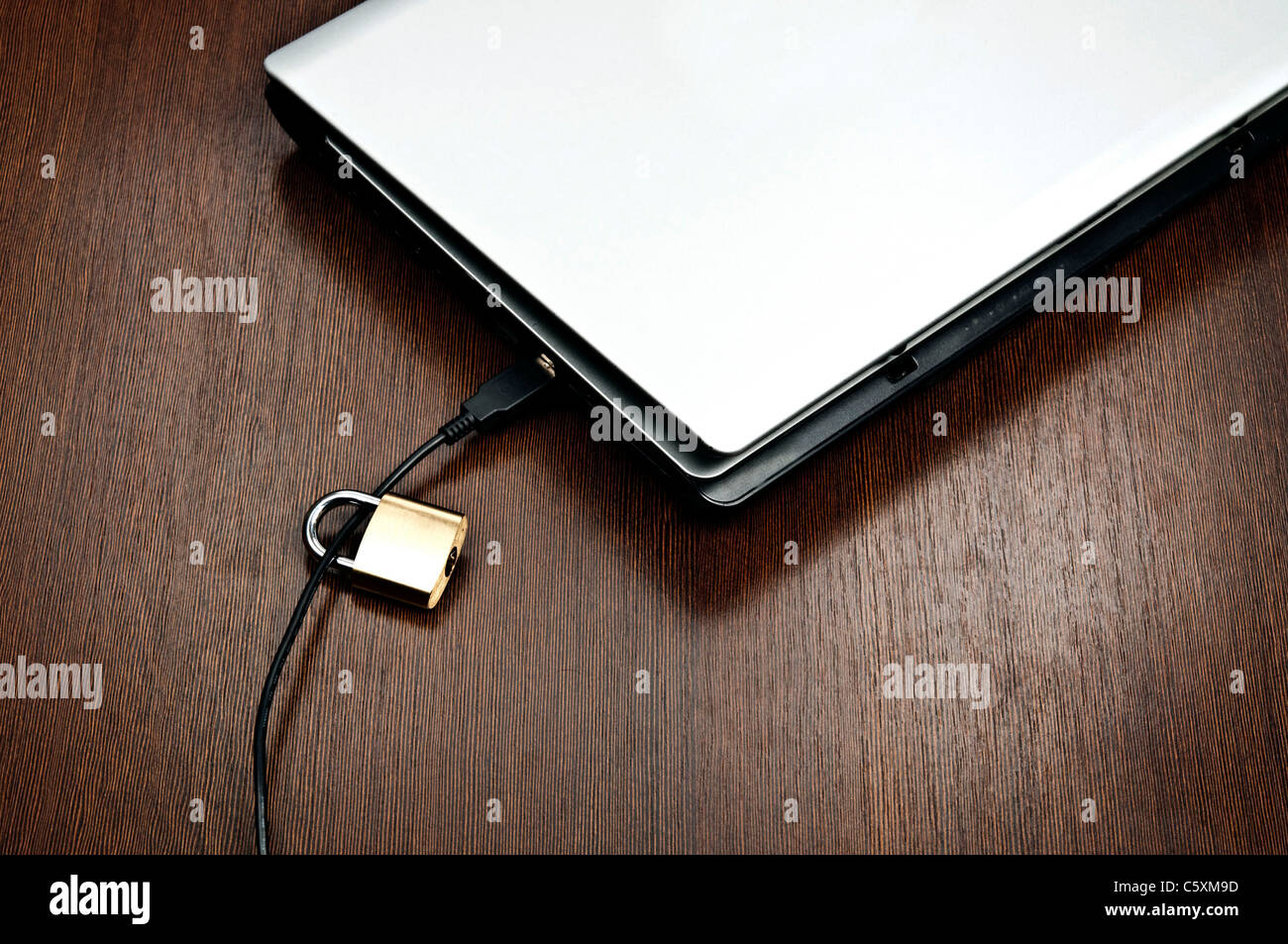 Laptop lock cable hi-res stock photography and images - Alamy