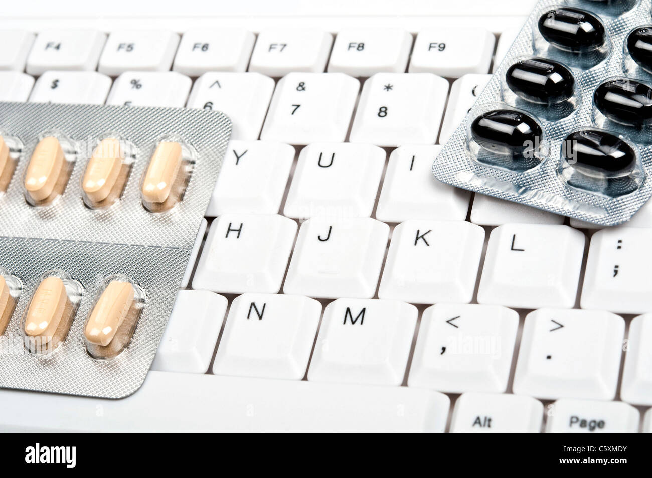 Medicine concept computer keyboard pill hi-res stock photography and ...