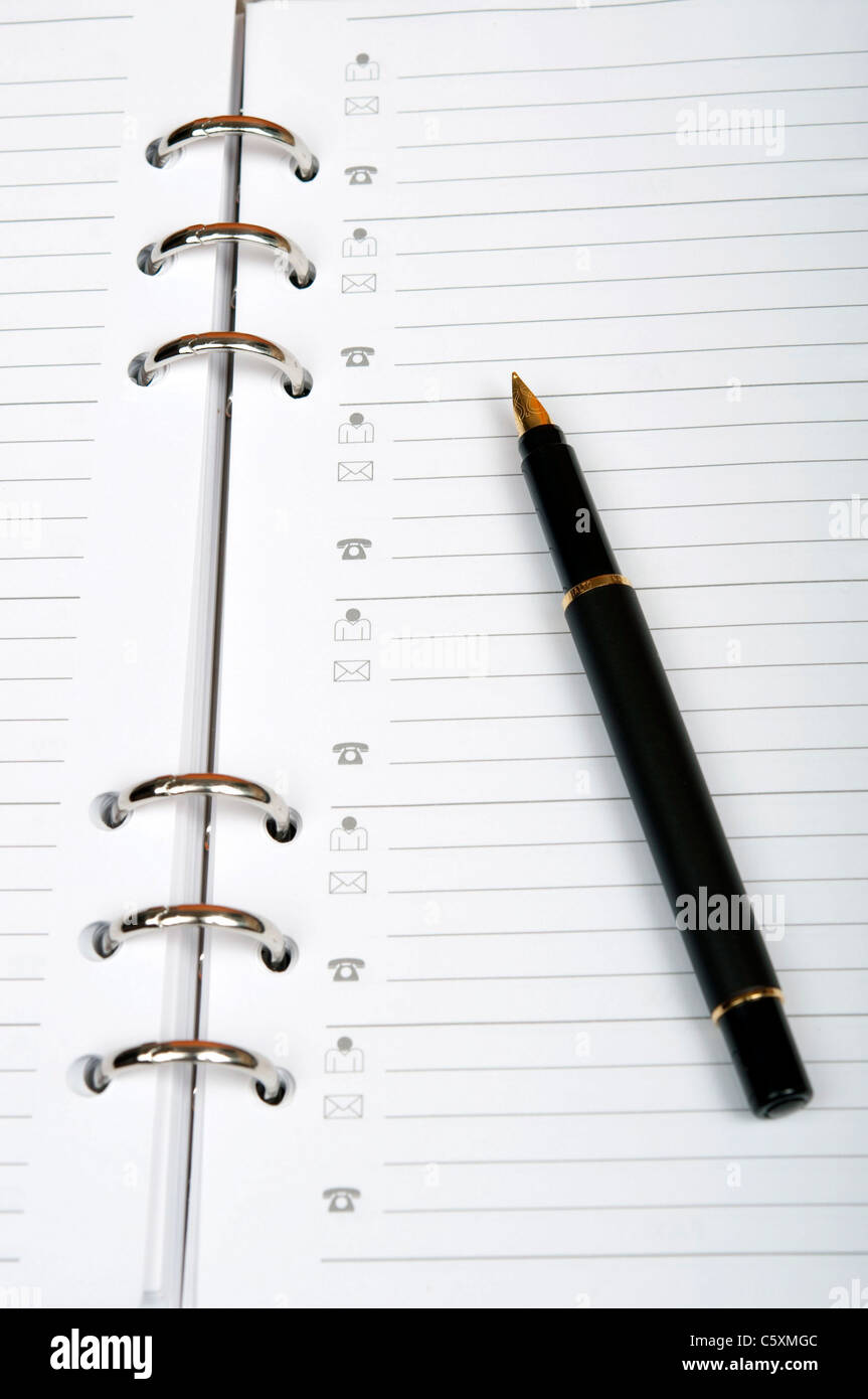 Notebook and luxury black pen Stock Photo - Alamy