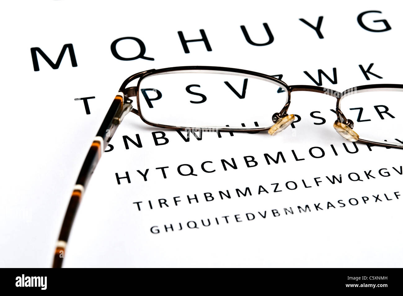 Eye glasses on examination paper Stock Photo - Alamy