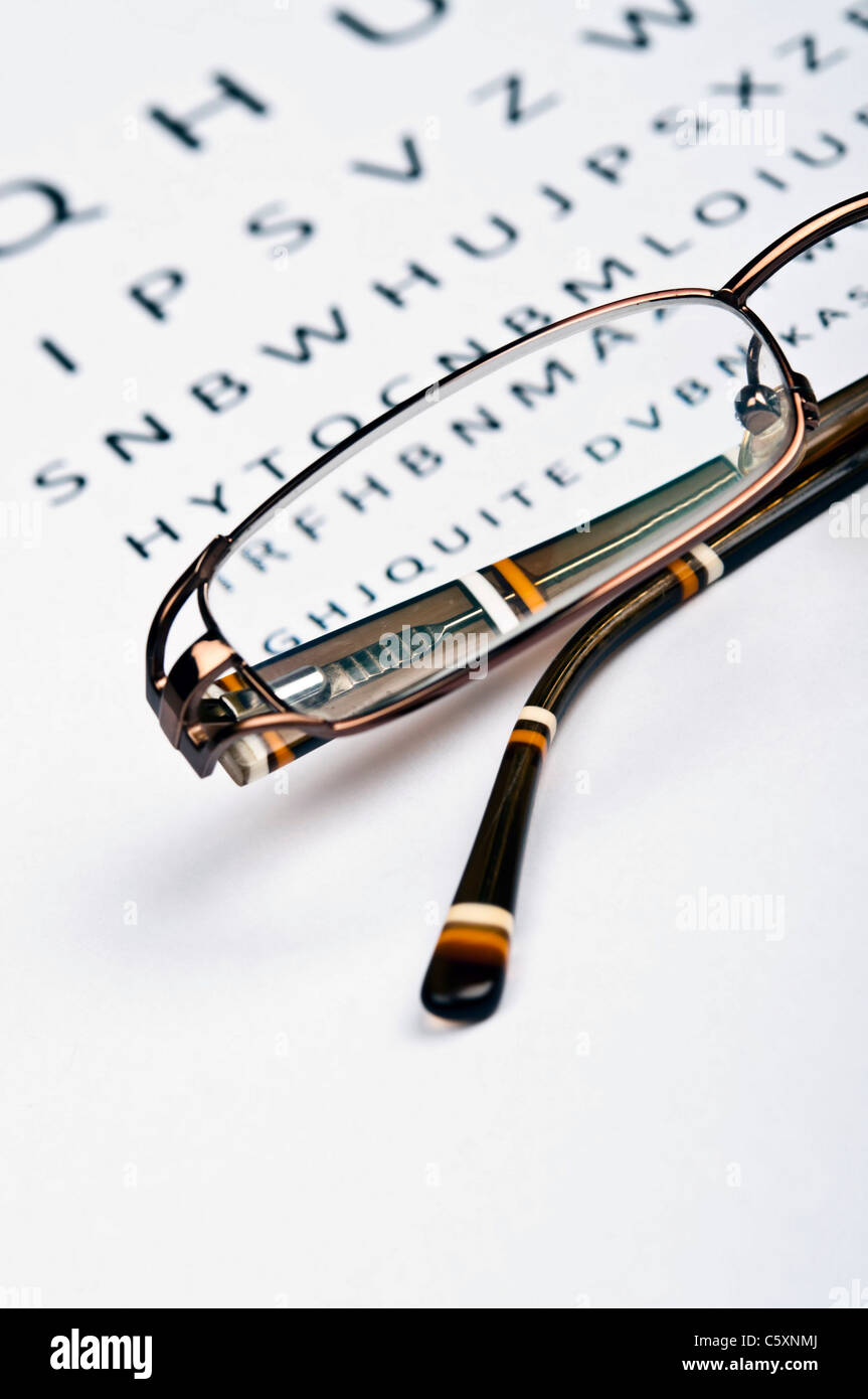 Eye glasses on examination paper Stock Photo - Alamy