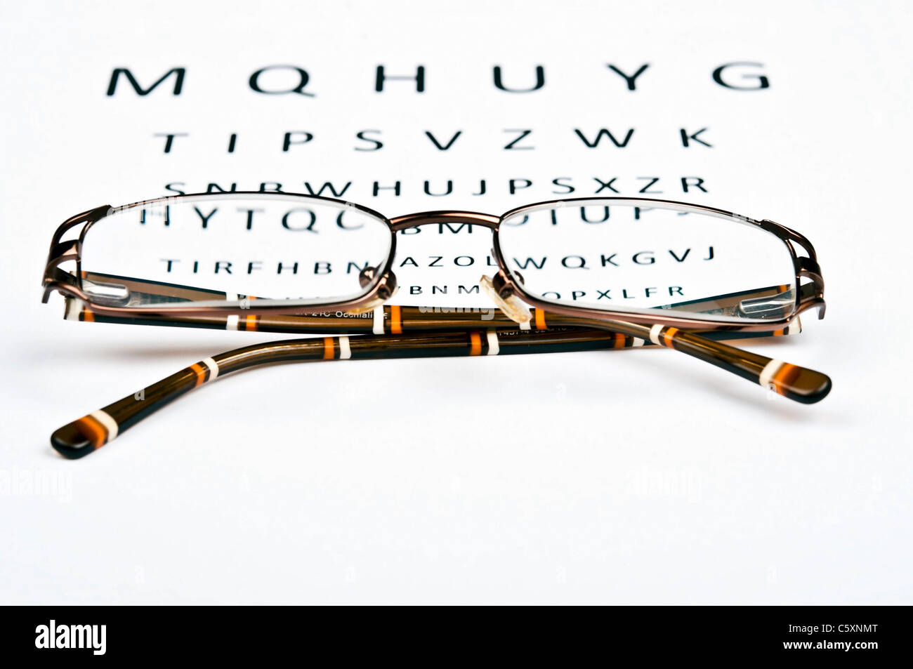 Eye glasses on examination paper Stock Photo - Alamy