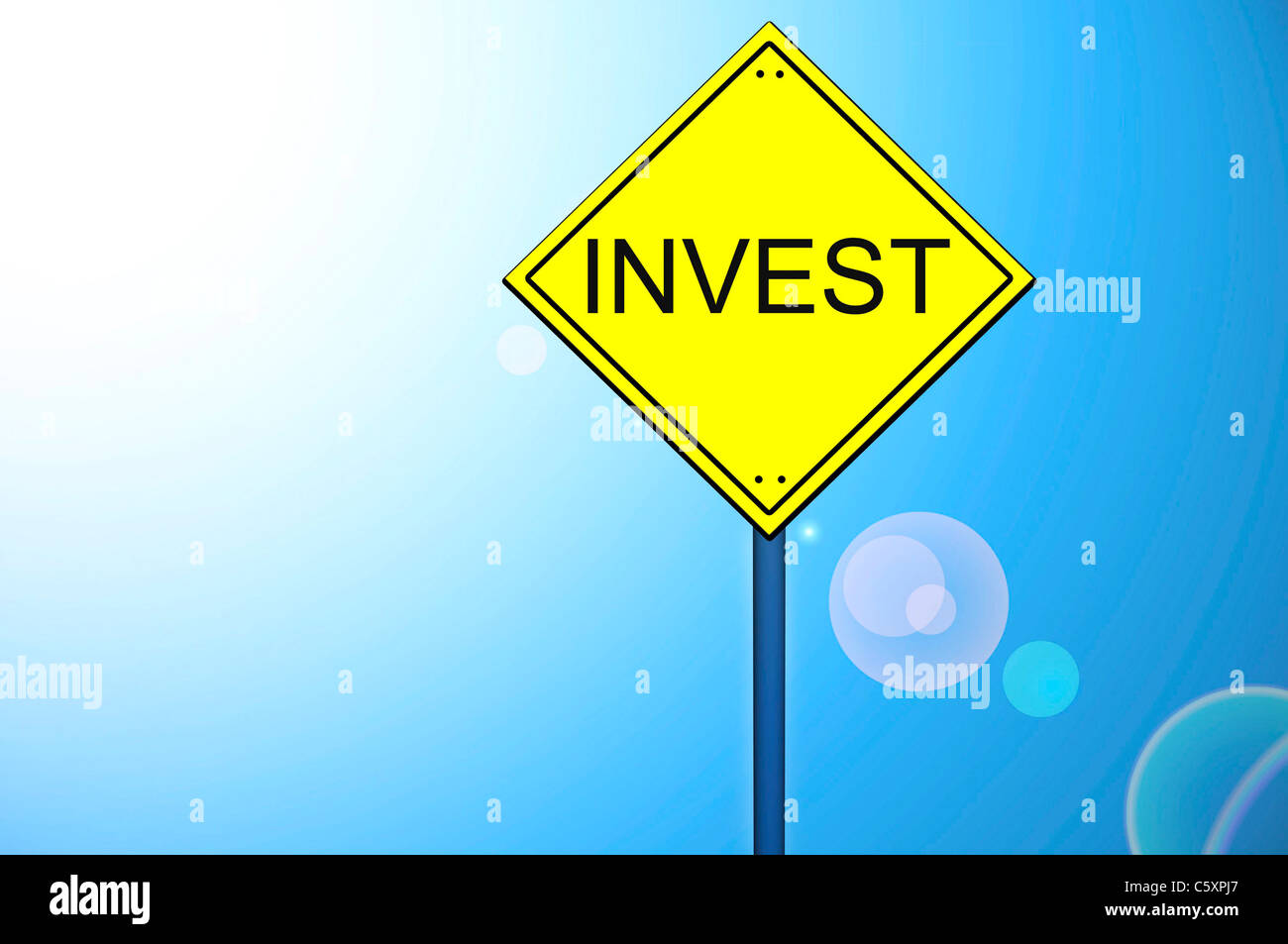 Invest word on yellow road sign Stock Photo - Alamy