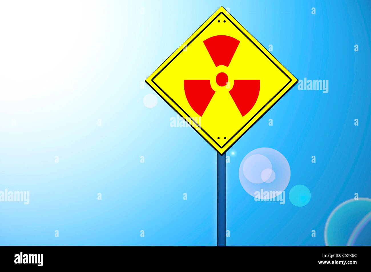 Nuclear shape on yellow road sign Stock Photo - Alamy