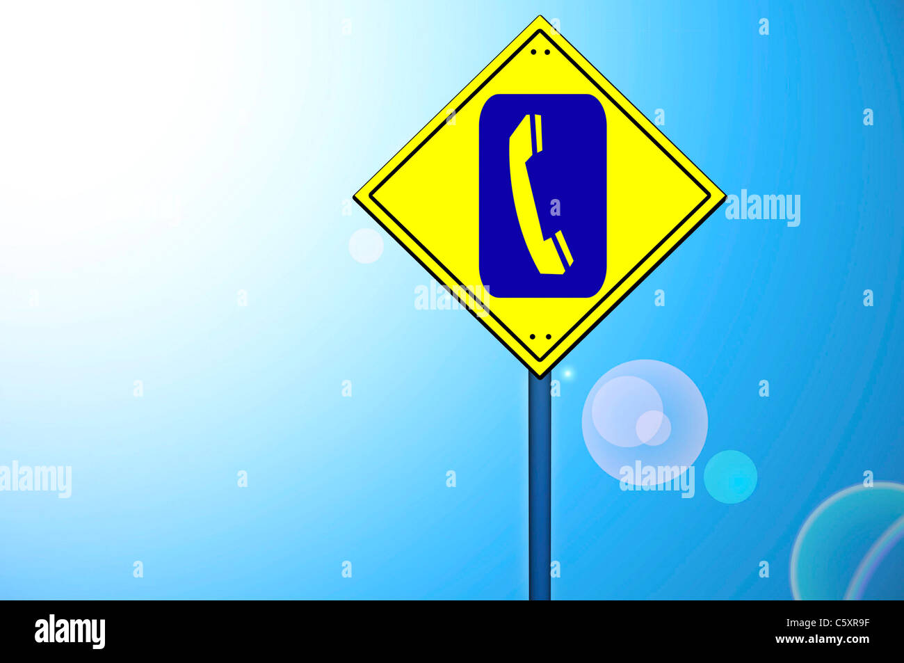 Phone shape on yellow road sign Stock Photo - Alamy