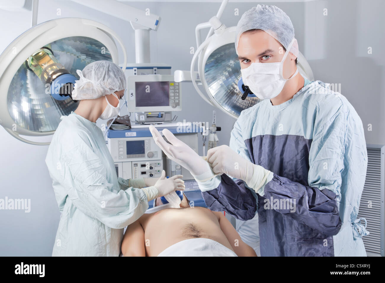 Doctor getting ready before the operation in operating room Stock Photo ...