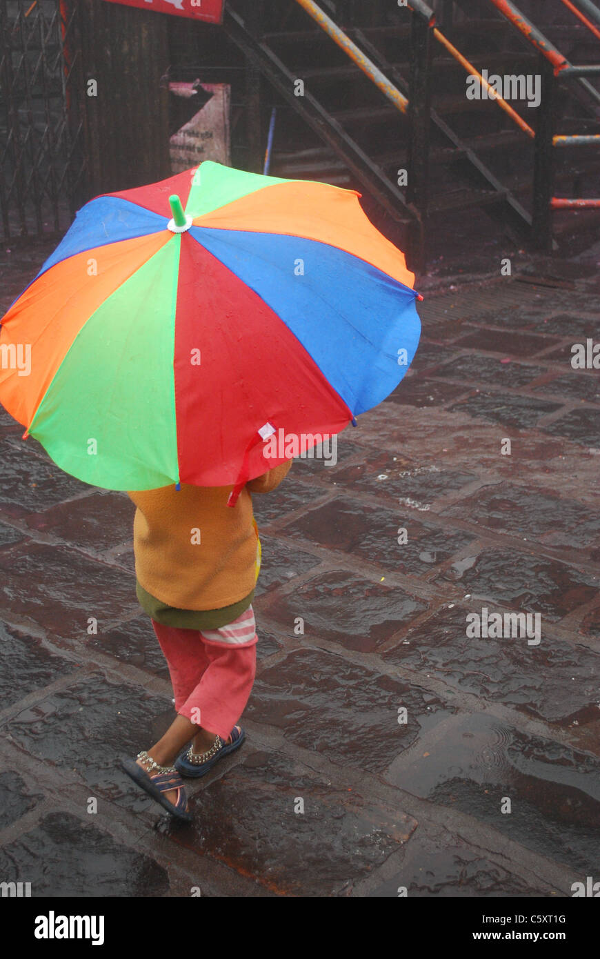Too small umbrella rain hi-res stock photography and images - Alamy