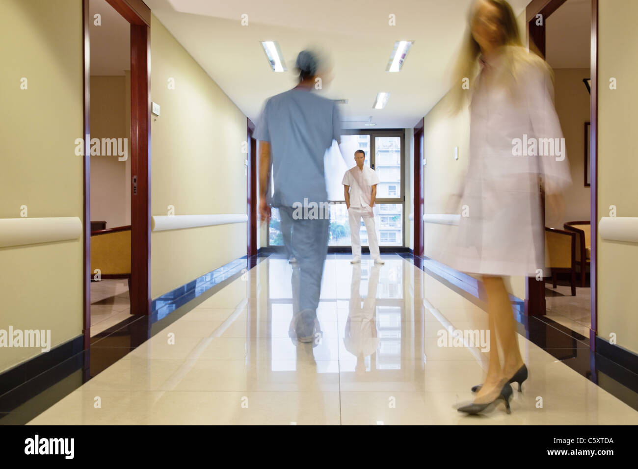 Staff walking through the hallway in hospital Stock Photo - Alamy