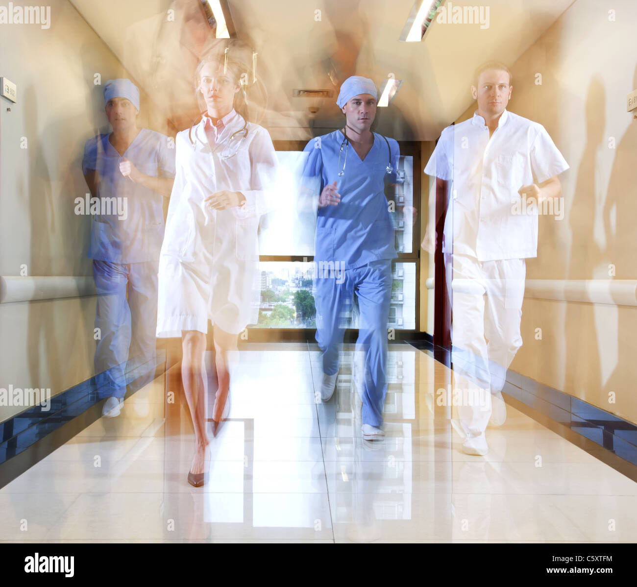 Team of doctor and nurse running in hallway of hospital Stock Photo - Alamy