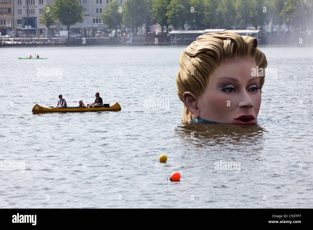 A 'mermaid' sculpture created by Oliver Voss is seen on Alster lake ...