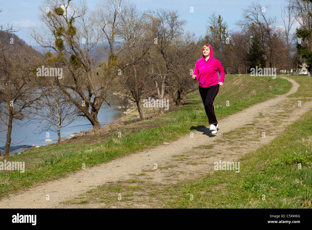 woman jogging in the park Stock Photo - Alamy
