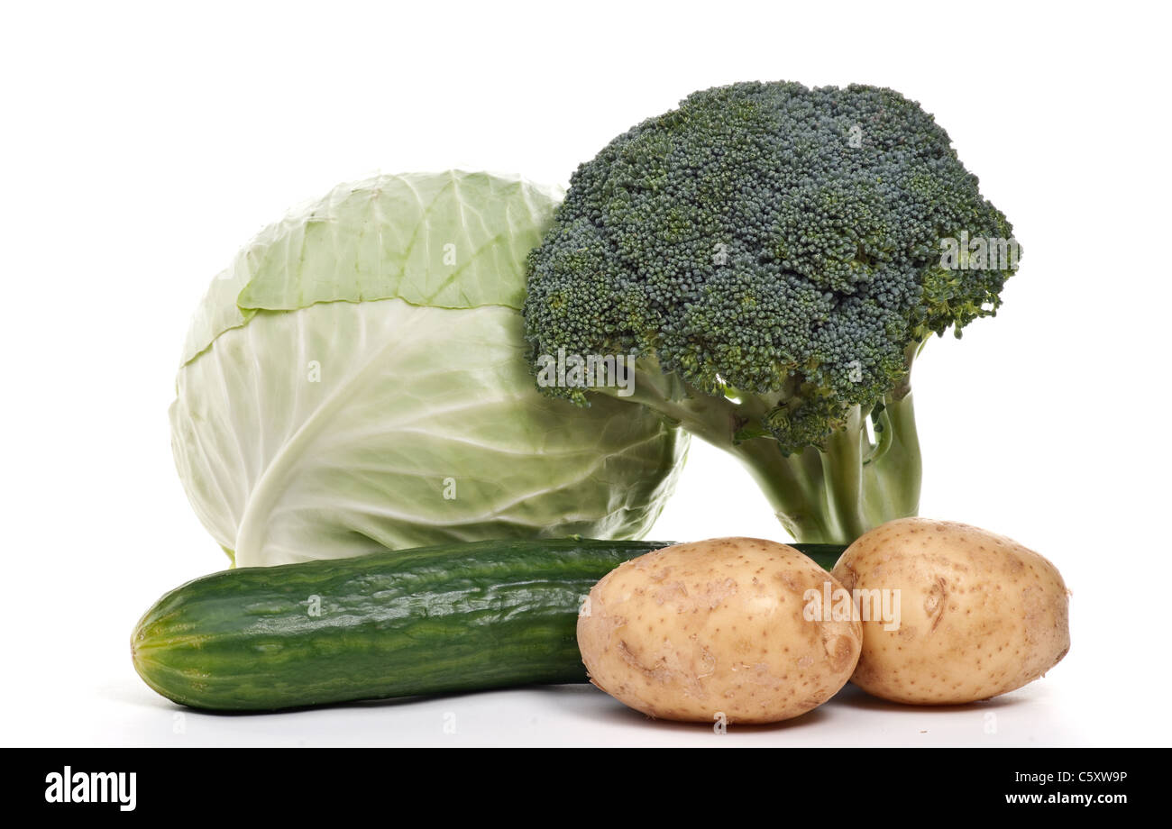 Basic fresh vegetables on white background broccoli cabbage cucumber ...