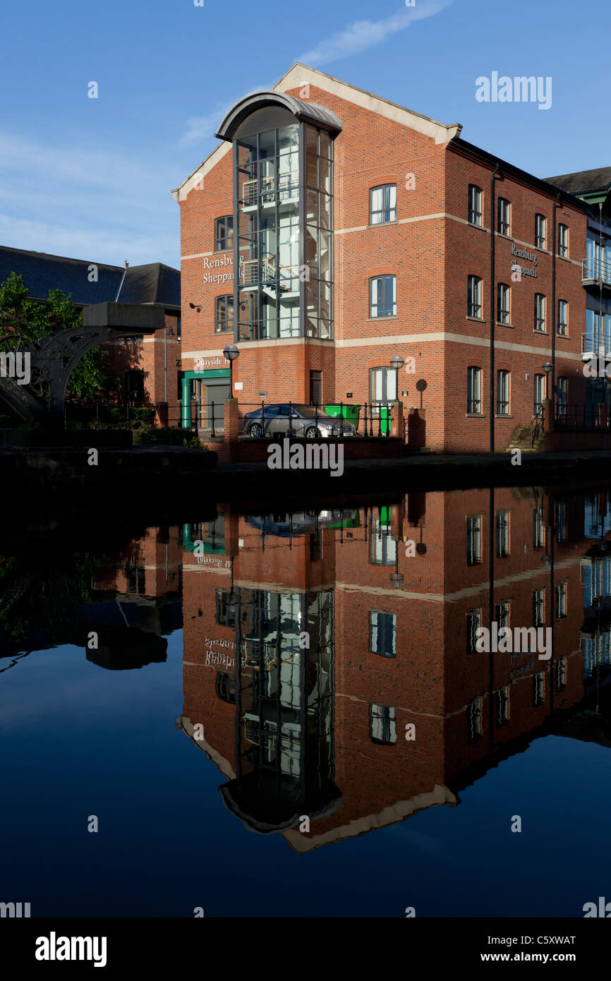 Modern buildings by The River Aire in Leeds, part of the waterfront ...