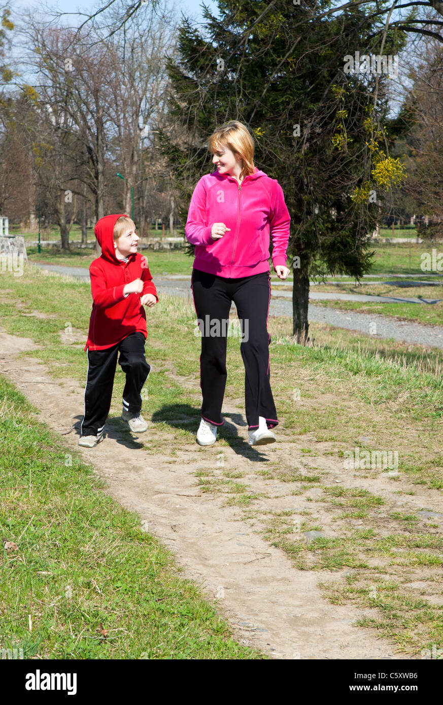 Mother with the son running on park Stock Photo - Alamy