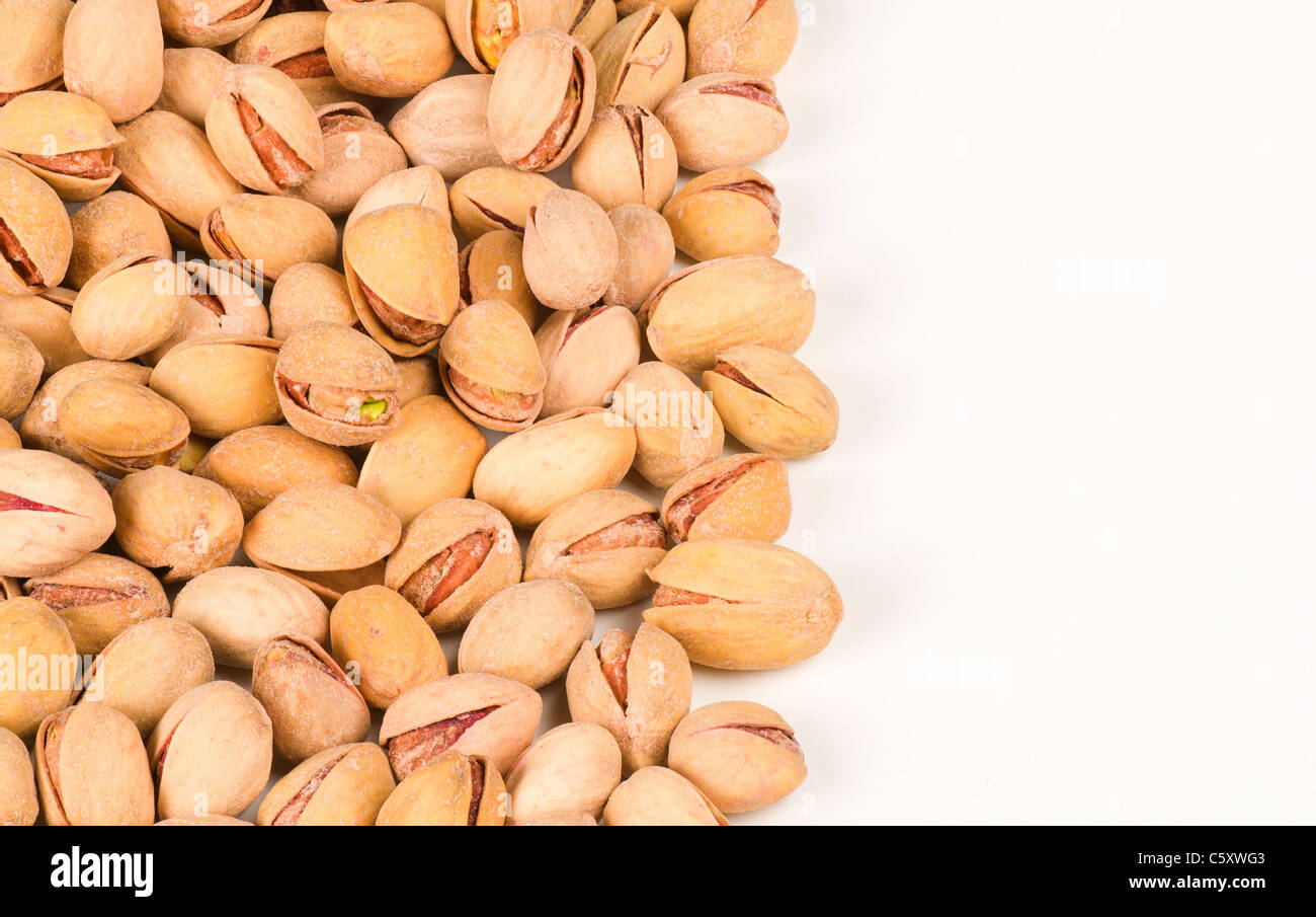 A heap of pistachios isolated on white Stock Photo - Alamy