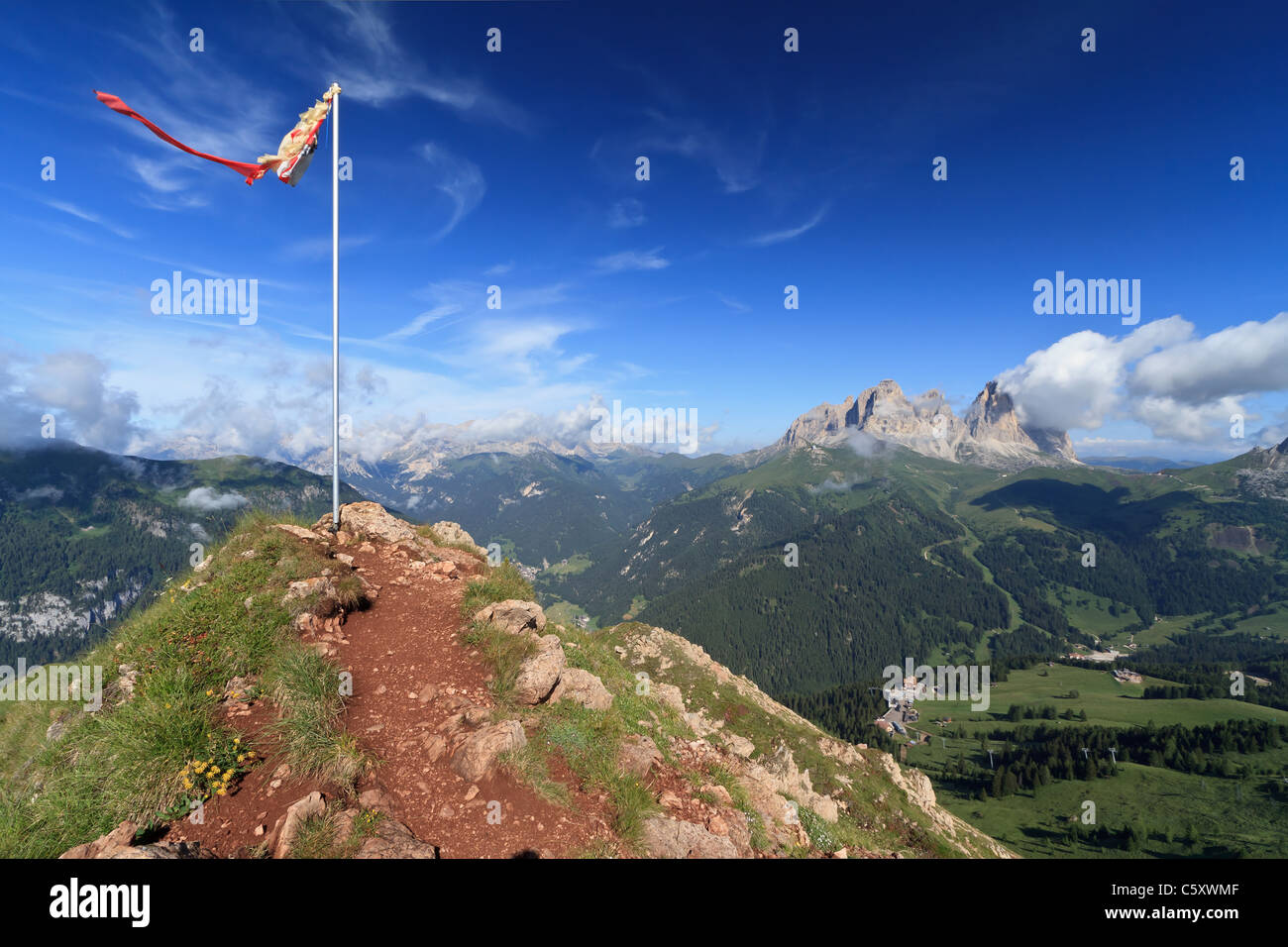 mountain peak with flag in Fassa Valley, Italian Dolomites Stock Photo ...