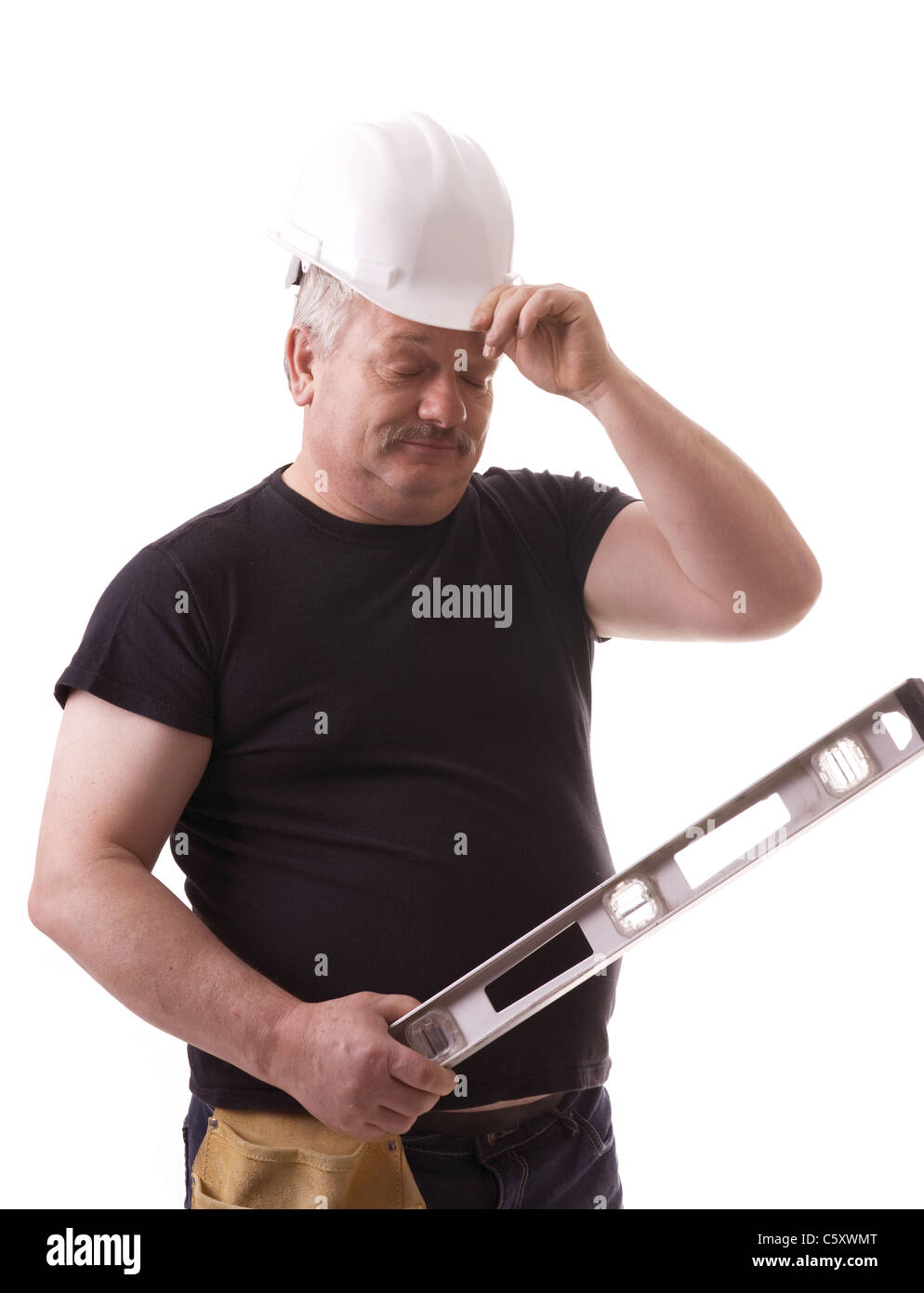 Contractor on the job trying to solve problem Stock Photo - Alamy