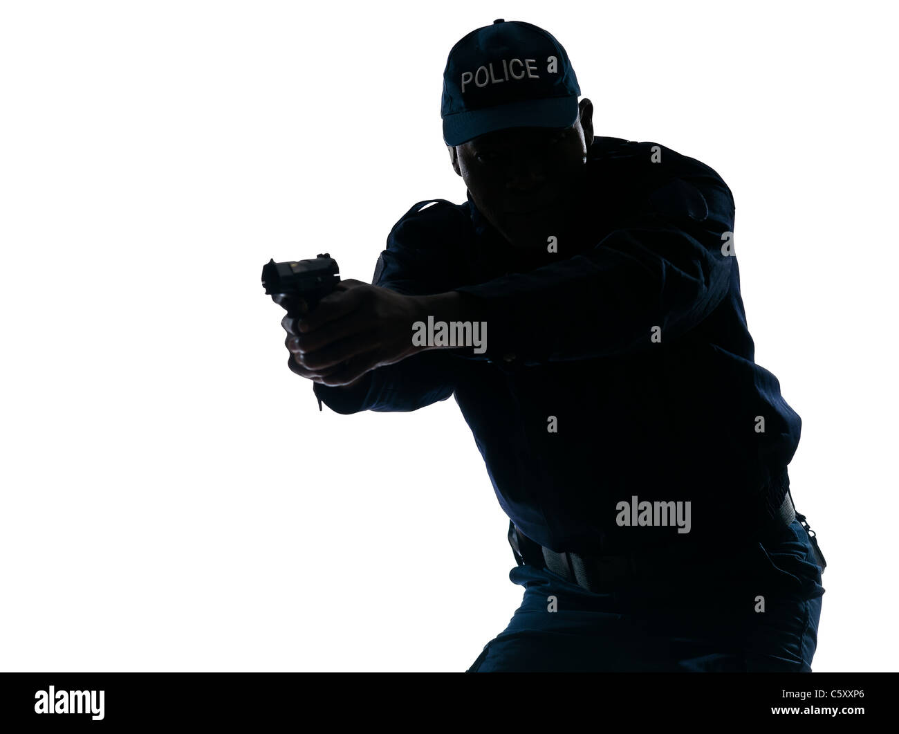 Silhouetted Afro American police officer aiming handgun isolated on ...