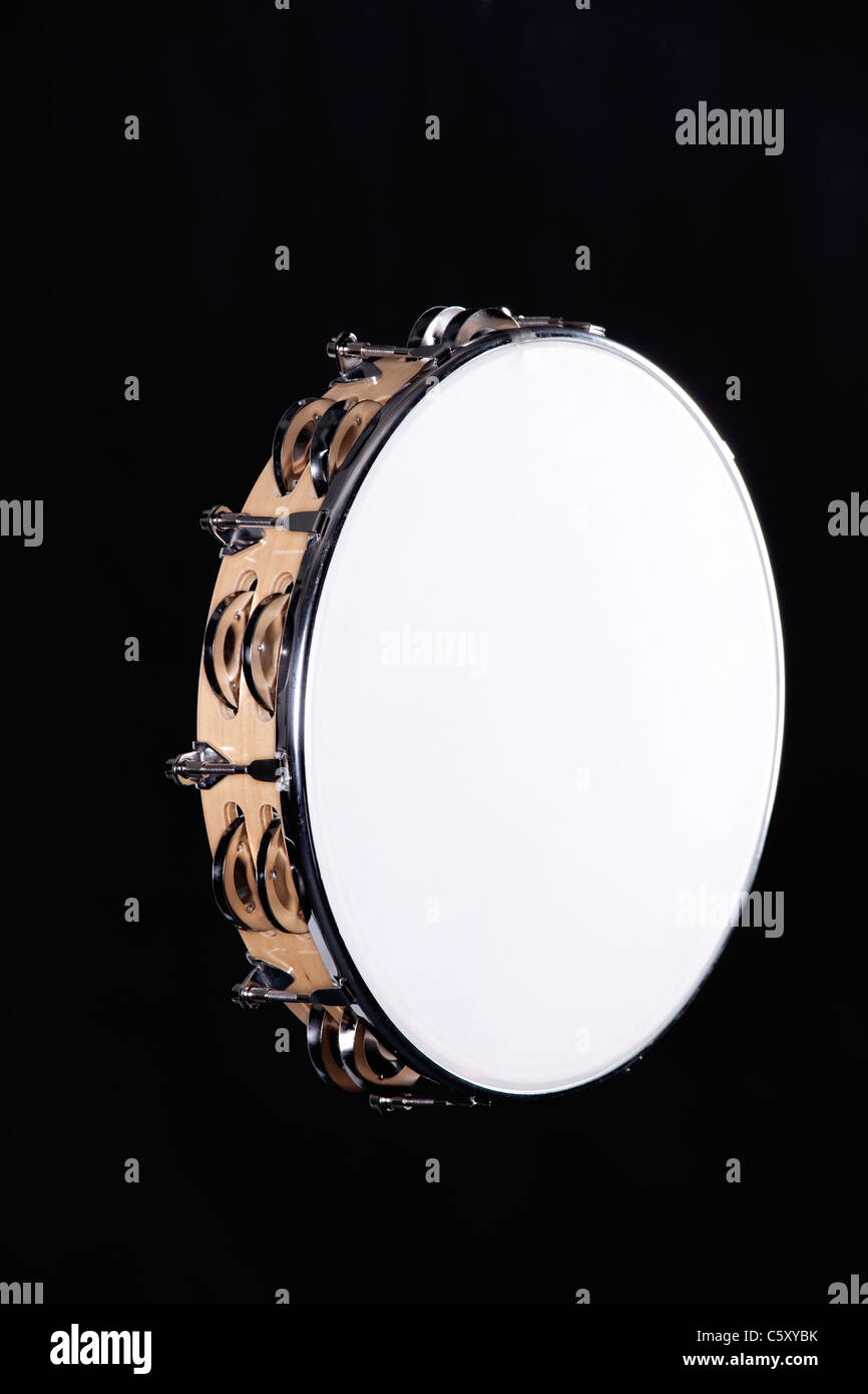 A natural wood tambourine percussion music instrument isolated against ...