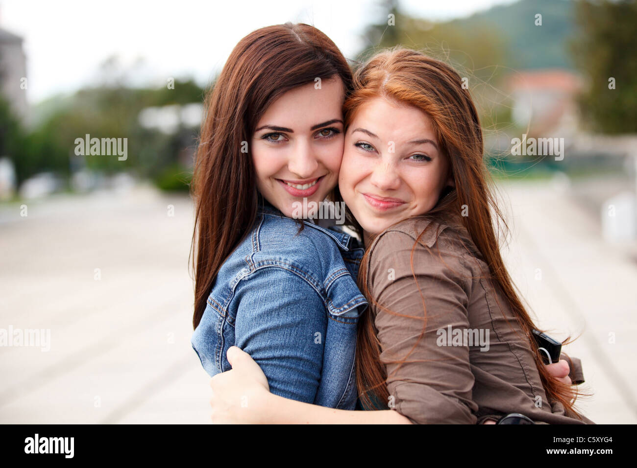 Portrait happy young and attractive girlfriends Stock Photo - Alamy