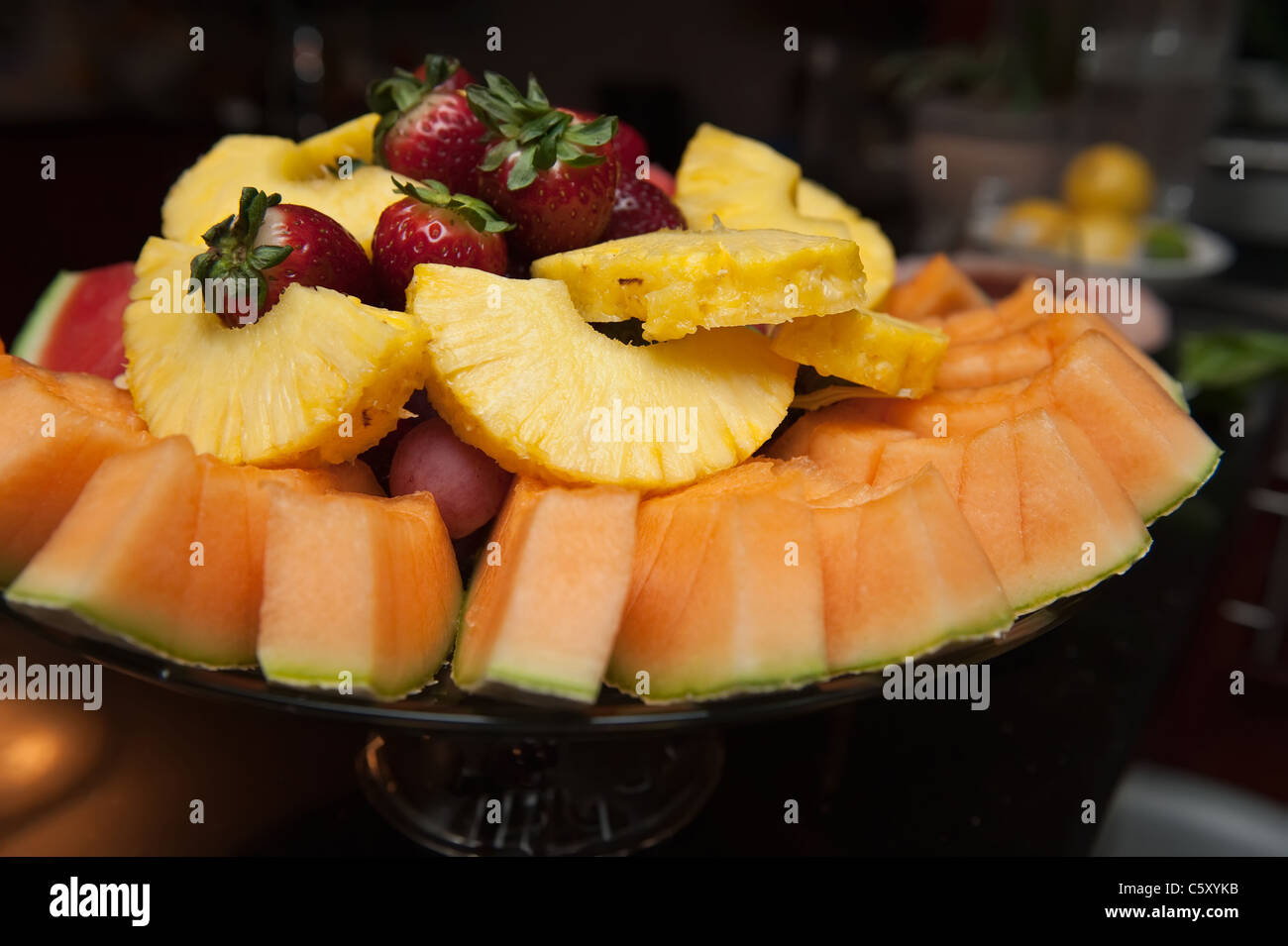 Fresh fruits composition on the plate Stock Photo - Alamy