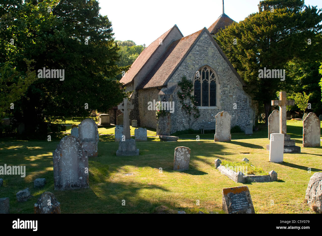 Saxon church and graveyard in East Dean, Sussex, England, UK Stock ...