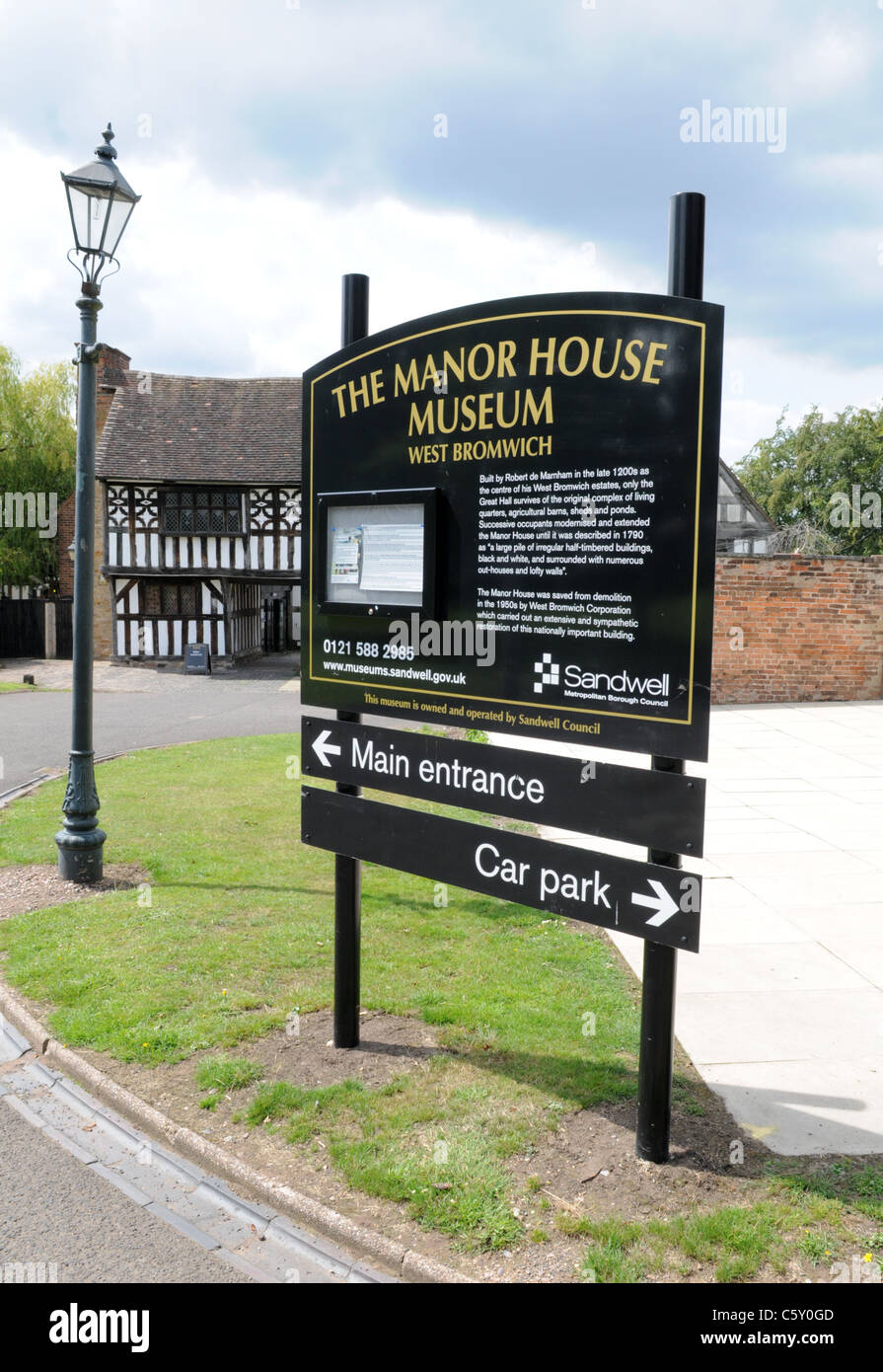 Sign in front of the historic Tudor black and white timber Manor House ...