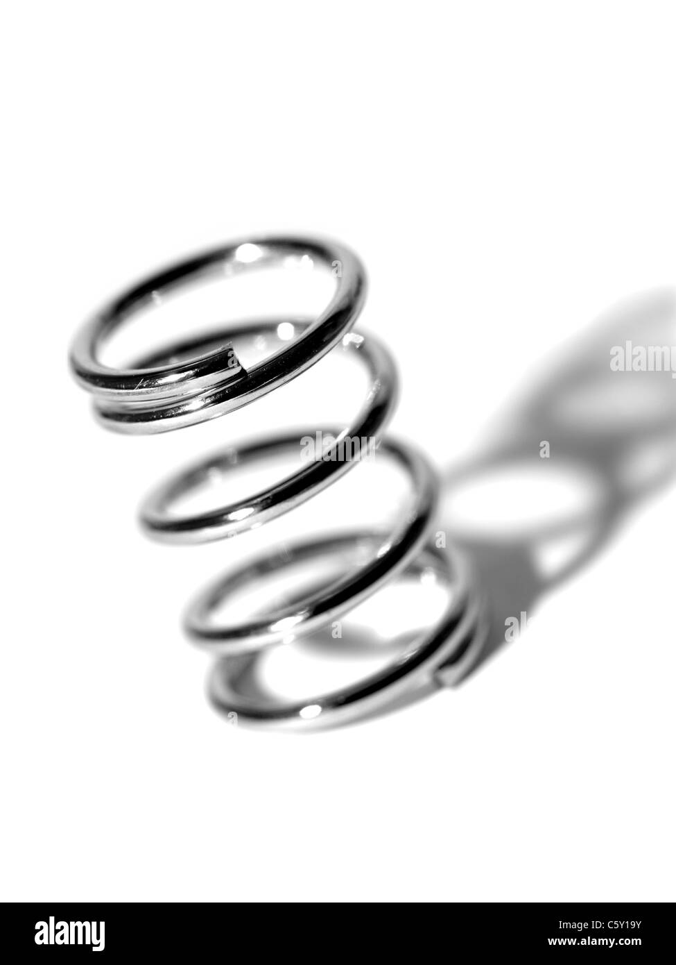 A spring isolated against a white background Stock Photo - Alamy