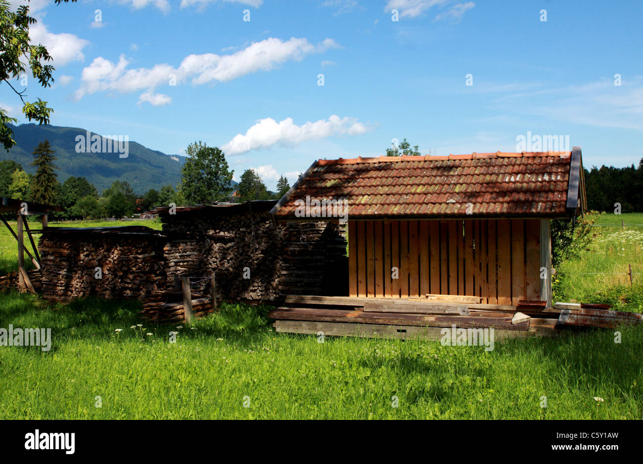 alpine landscape with house with firewoods Stock Photo - Alamy