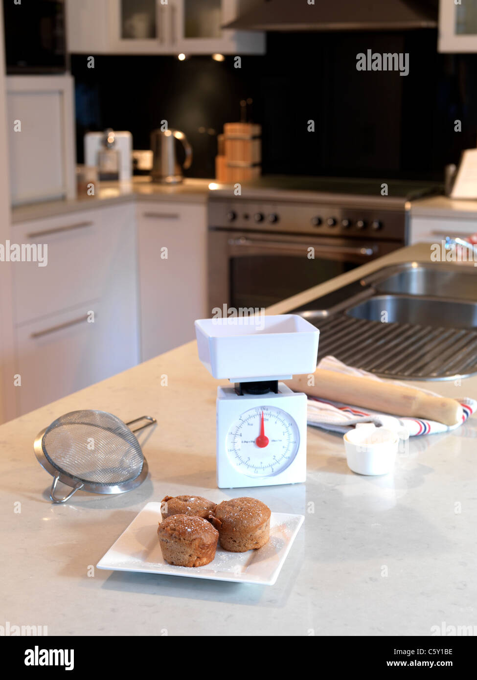 A modern kitchen being used for food preparation Stock Photo - Alamy