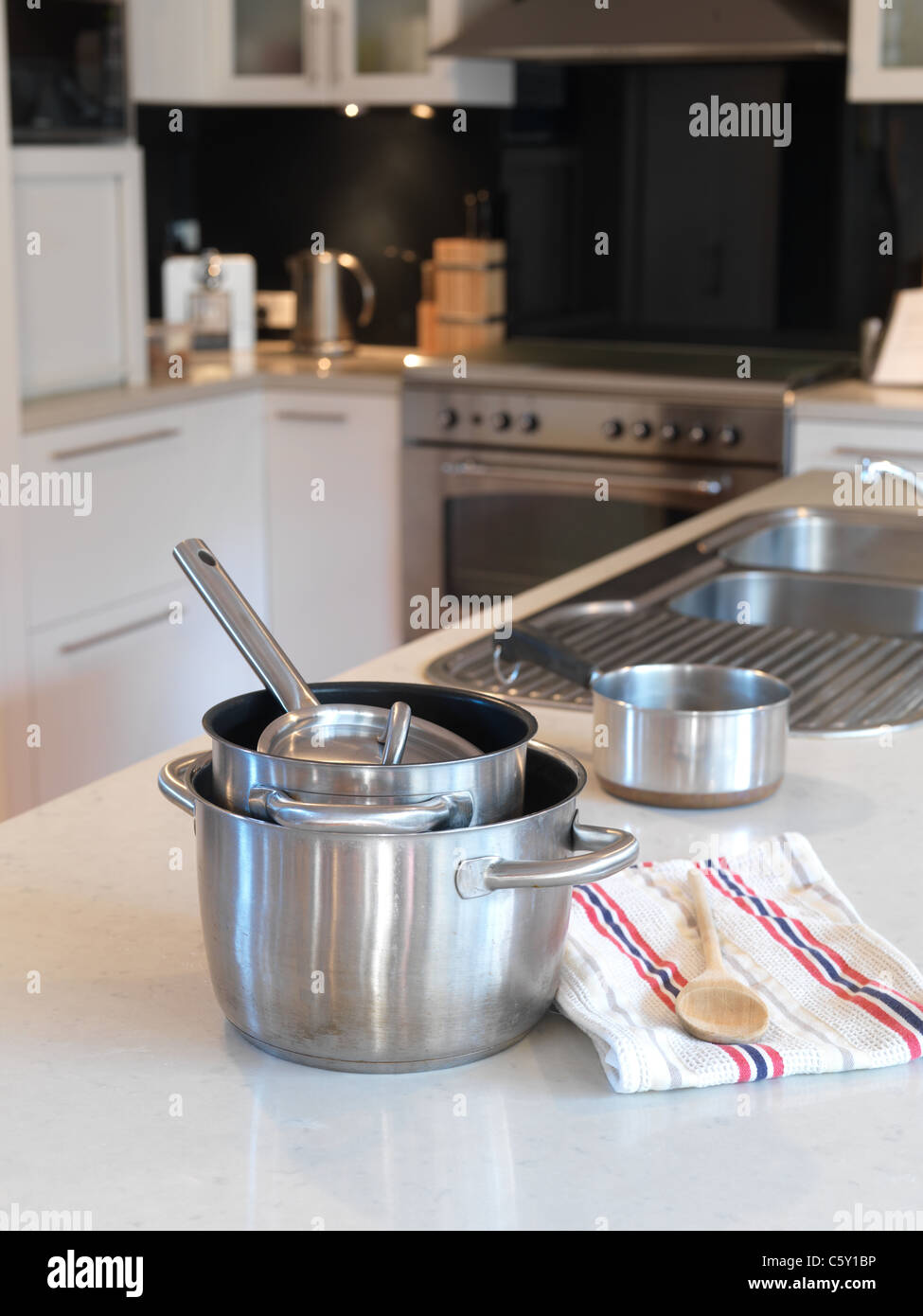 A modern kitchen being used for food preparation Stock Photo - Alamy