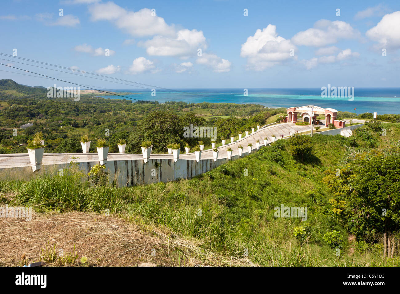 Entrance road to resort overlooking Caribbean Sea on the island of ...