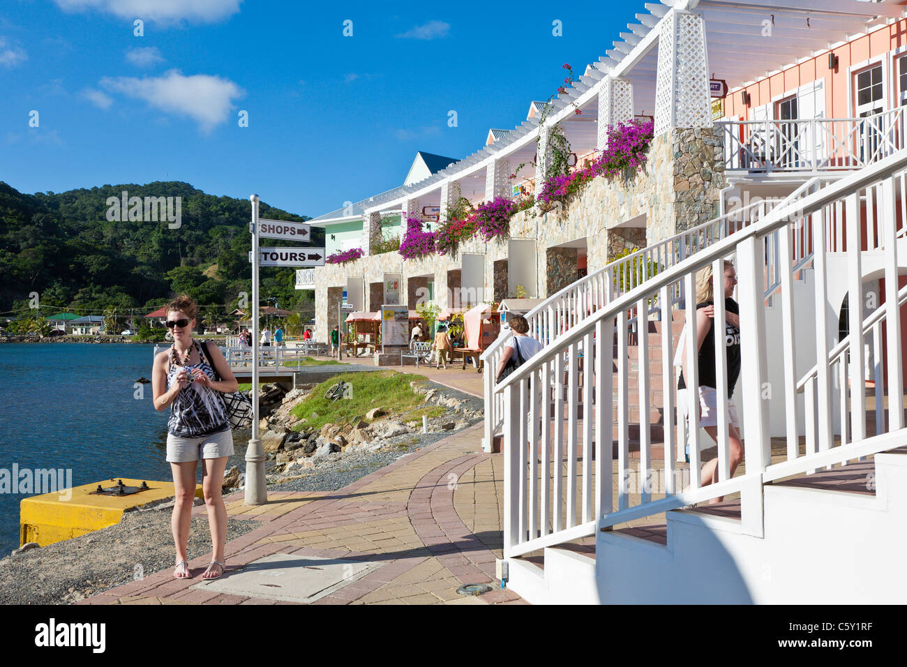 Young tourist woman at Town Center cruise port and shops at Coxen Hole ...