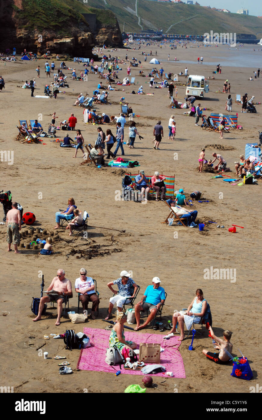 Crowds of people on the beach, at the seaside Stock Photo - Alamy